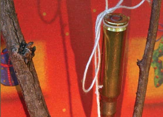 GUNS Magazine AND A CARTRIDGE IN A BARE TREE - GUNS Magazine